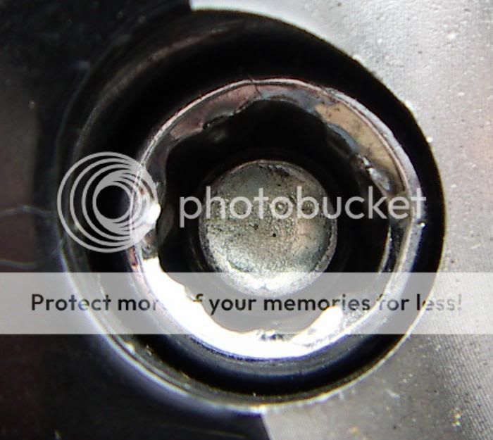 Damaged lock nut – anyone know how to remove it?